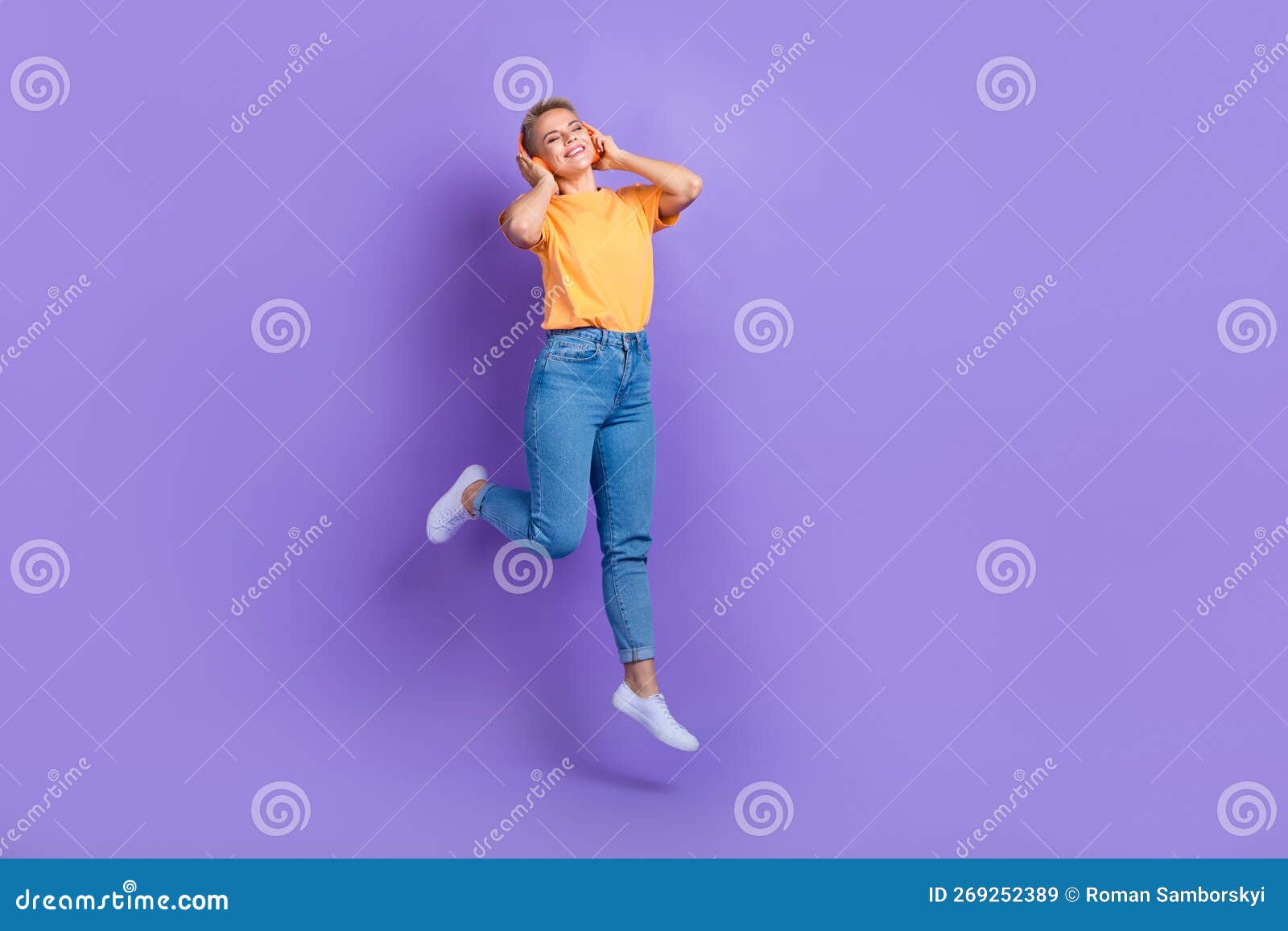 Full Size Photo Of Optimistic Satisfied Girl Wear Sneakers Denim Pants