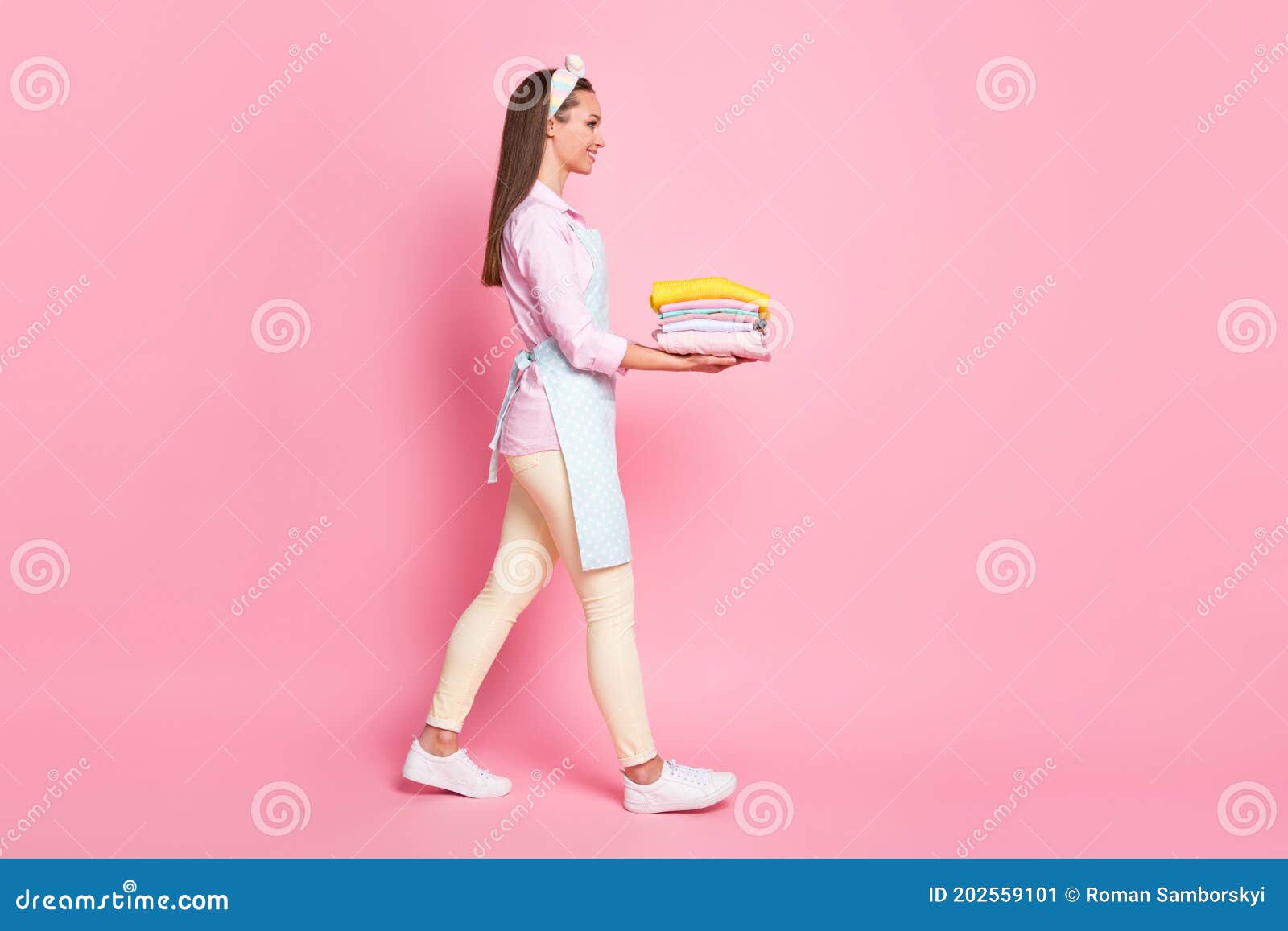 Full Size Profile Side Photo Of Positive Cheerful Girl Maid Hold Neat