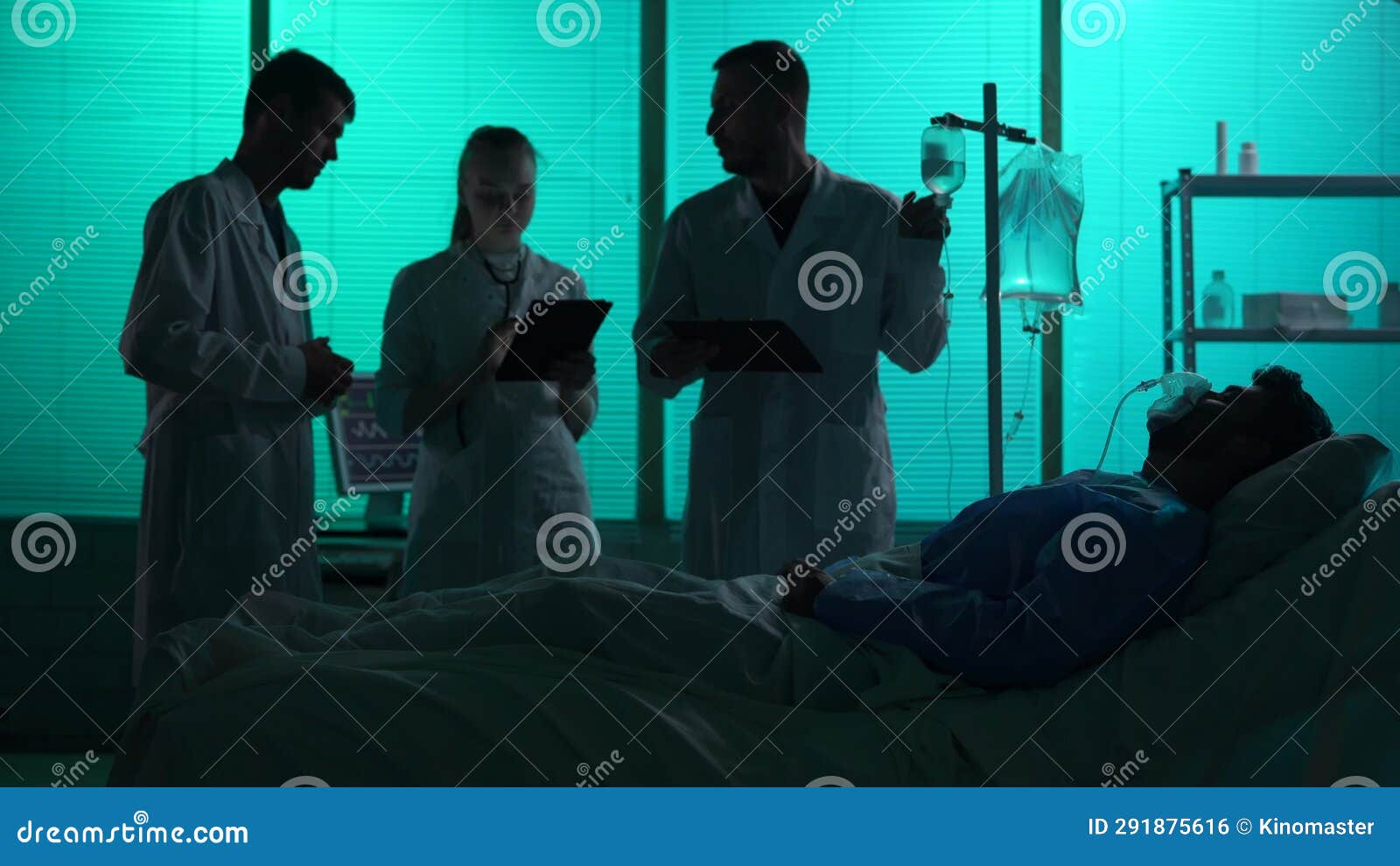 Full-sized Silhouette Video of Three Doctors Standing Around a Patient ...