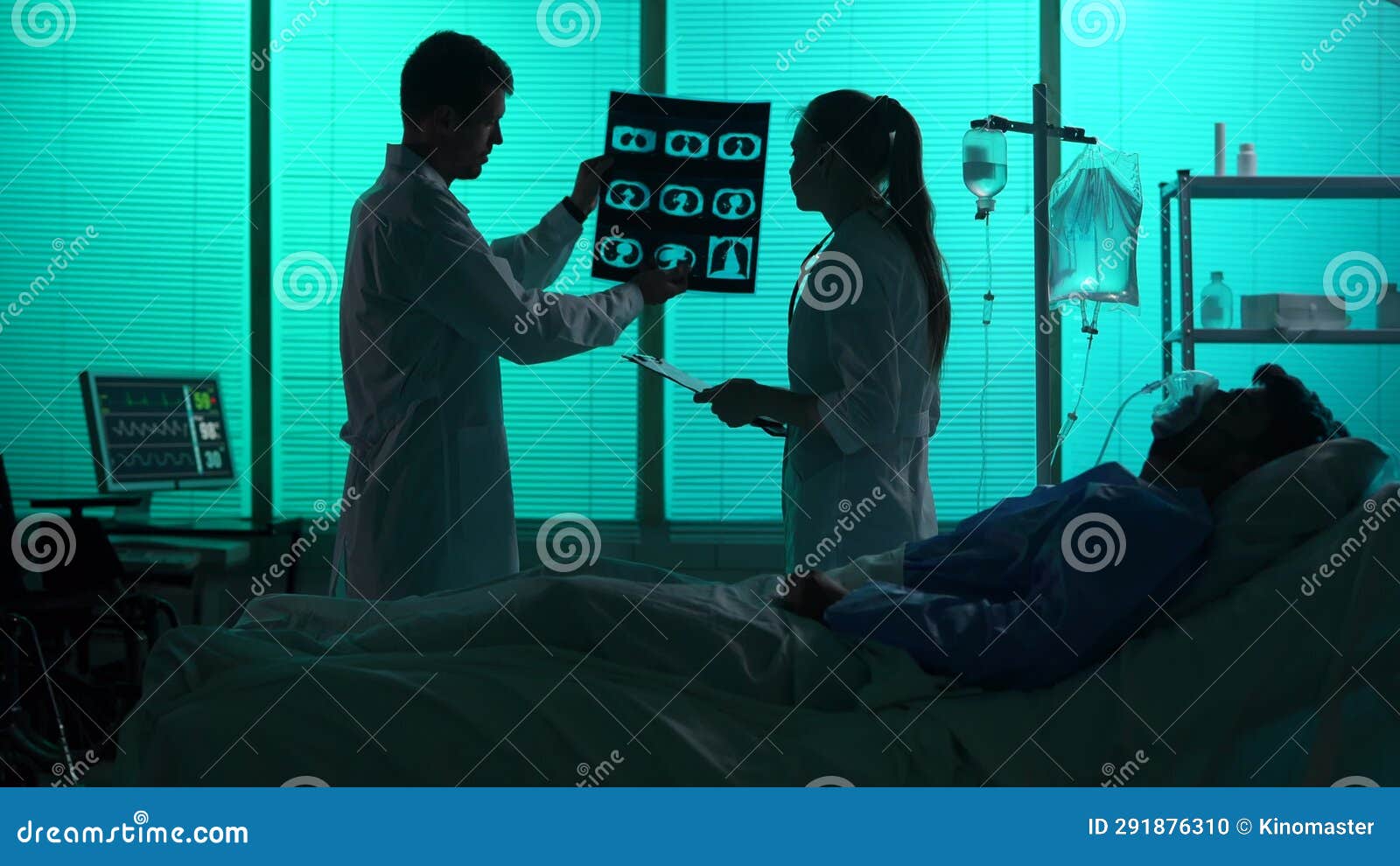Full-sized Silhouette Video of Two Doctors Standing Behind a Patient on ...