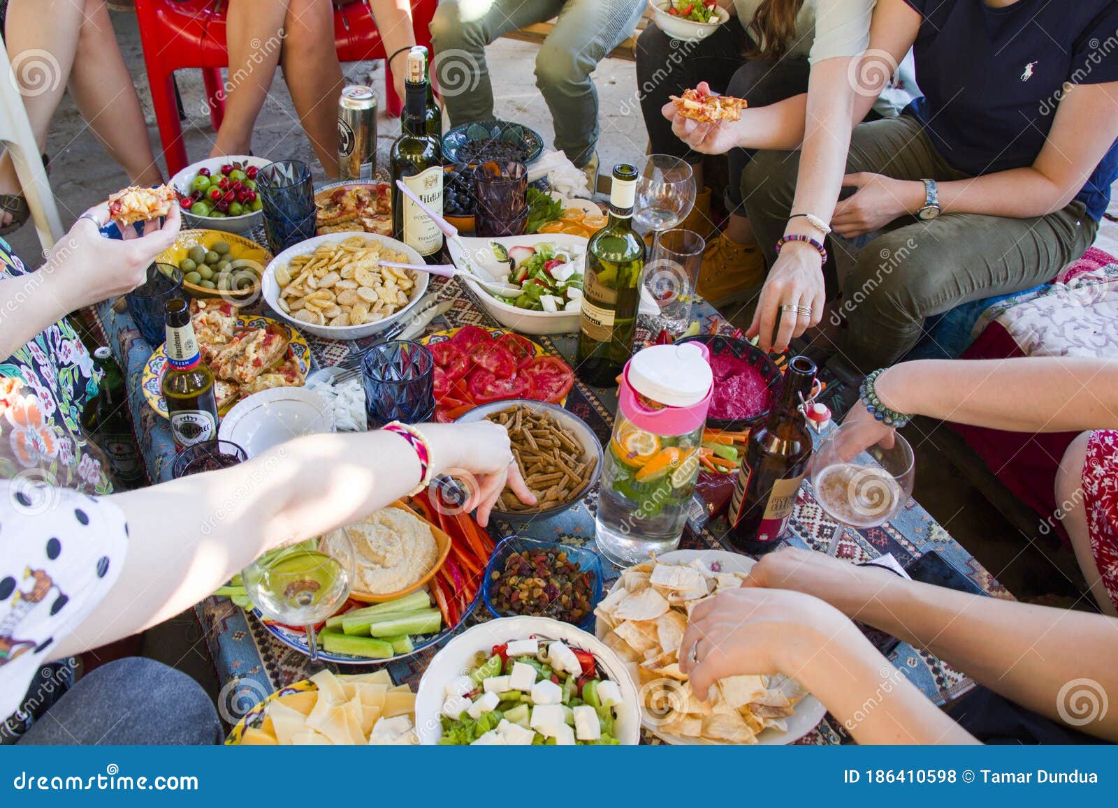 Full Table , People Hands and Eating Process. Friends at the Table ...