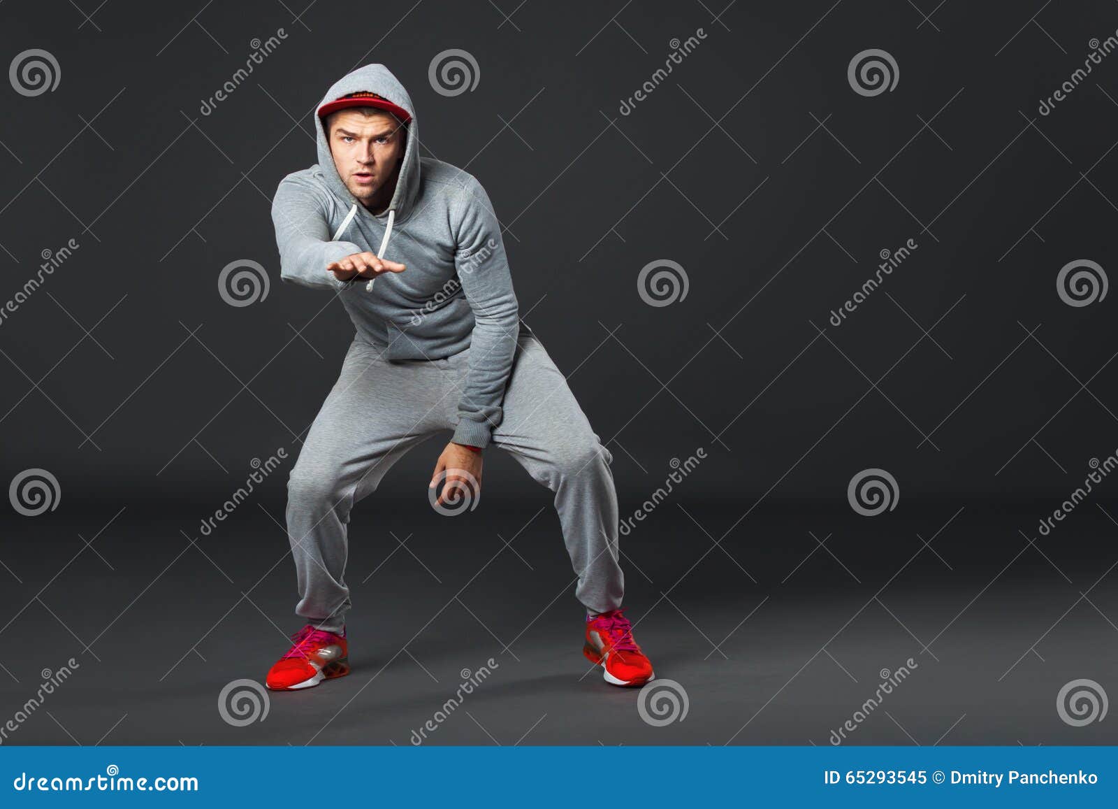 Fullbody Portrait Of Young Cool Man Dancing On Dark Background. Royalty ...
