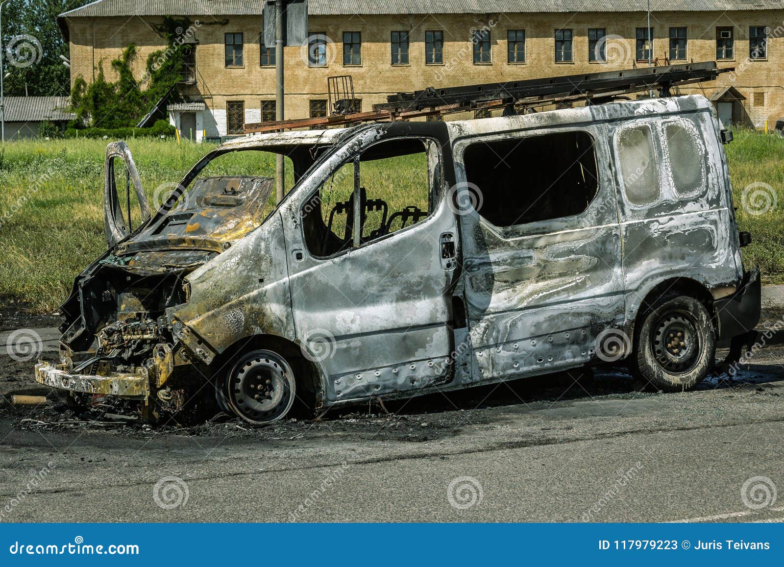 Fully burned car on a road stock image. Image of broken - 117979223