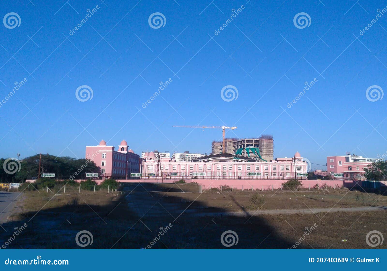 Fully Constructed School Building in Front and Under Construction ...