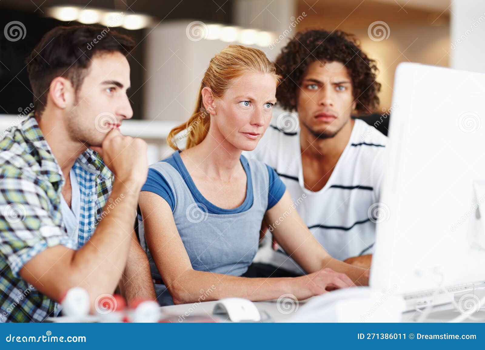 Fully Focused on Their Team Project. a Group of Colleagues Working in ...