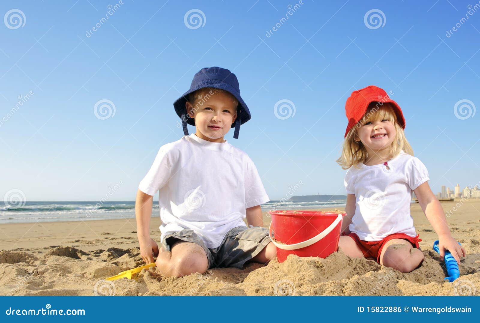Gorgeous Brother And Sister Sunbathing On A Sandy Beach Stock Photo ...