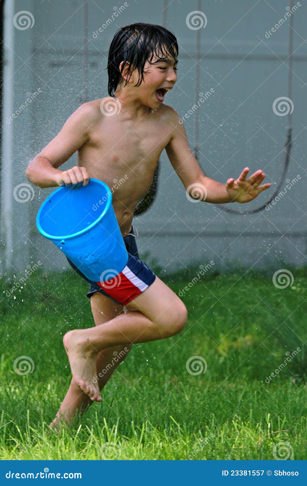 Fun with a Blu Bucket of Water Stock Image - Image of hose, laughs ...