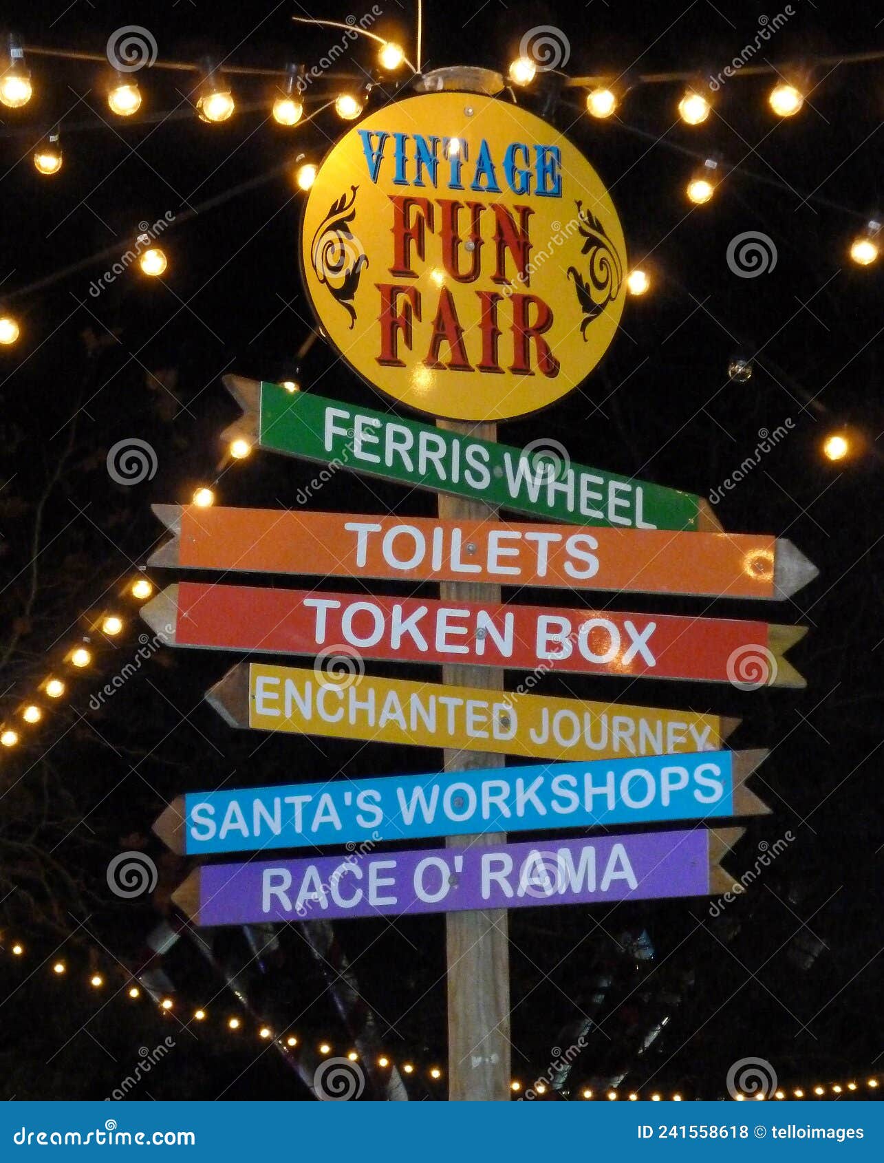 Fun Fair Sign Post at Night with Twinkly Lights Stock Photo - Image of ...