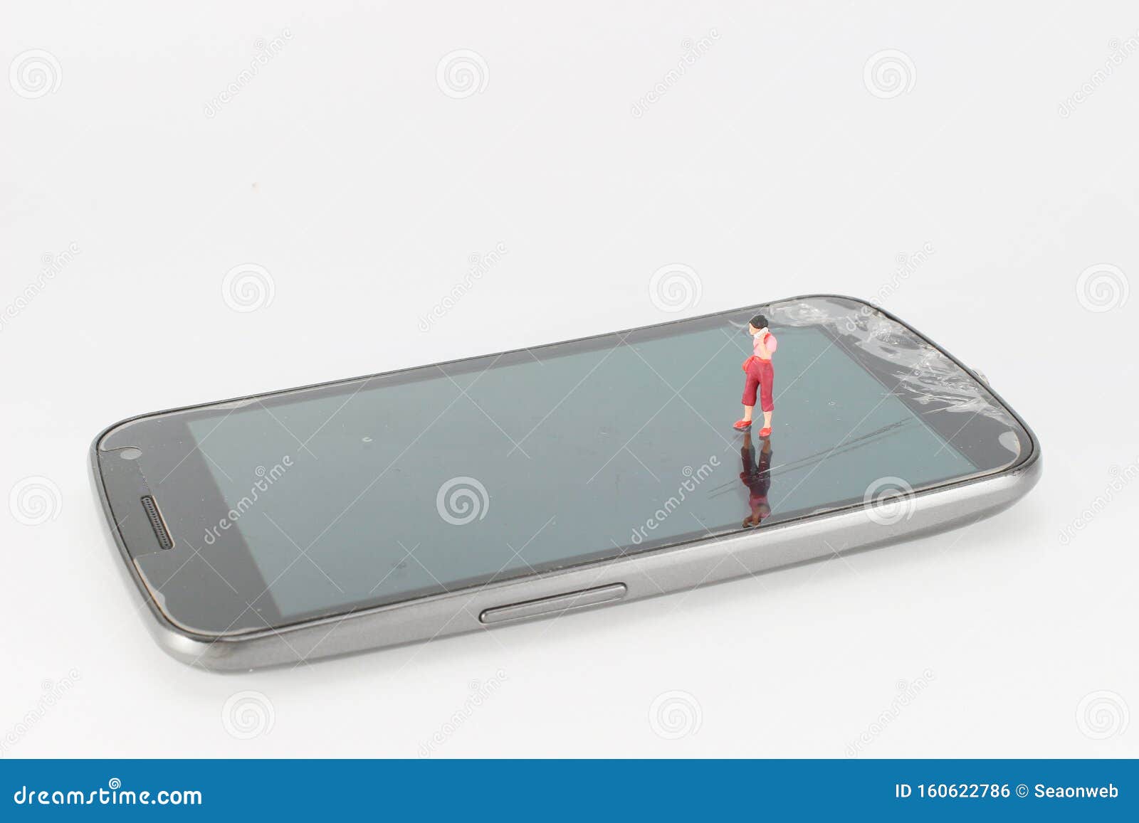 A Fun of Figure Talking a Mobile Phone Stock Photo - Image of cellphone ...