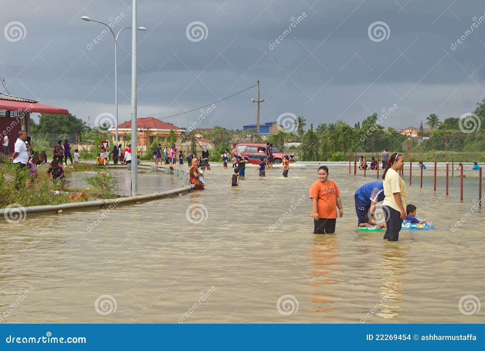 Fun in Flood Water editorial stock image. Image of families - 22269454