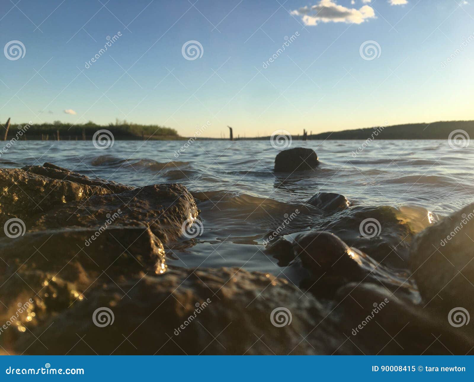 Fun at the lake stock image. Image of rocks, waves, lake - 90008415