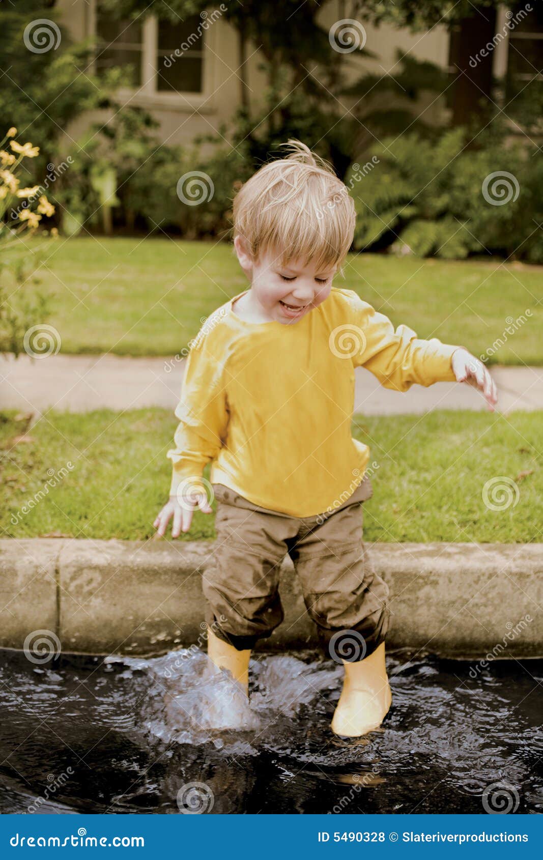 Fun in the puddle stock photo. Image of tree, spring, play - 5490328