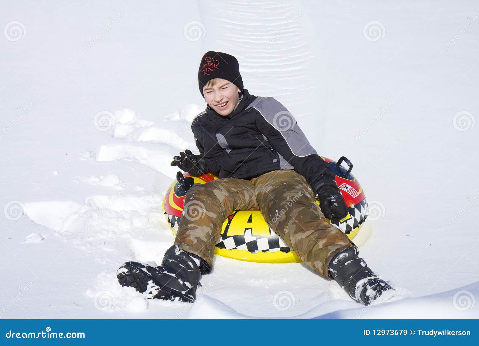 Fun in the Snow stock image. Image of tube, snow, sledding - 12973679