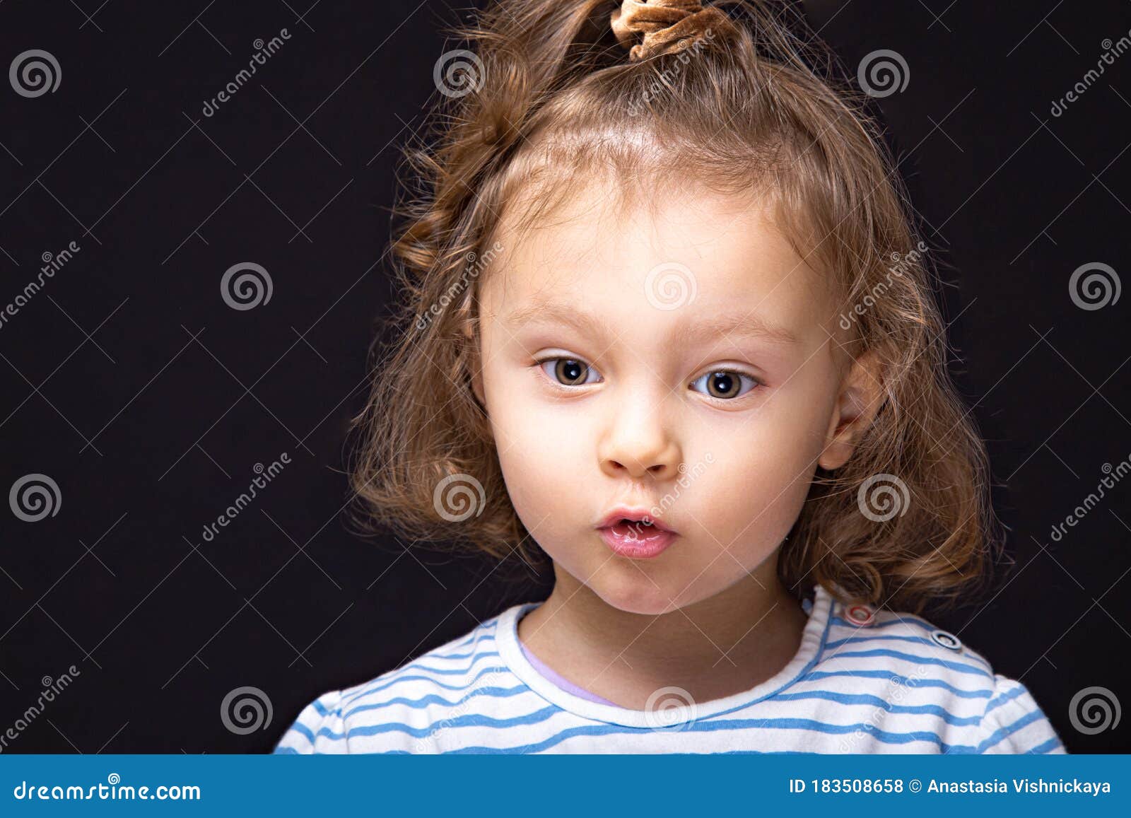Fun Surprising Look Small Kid Girl with Grimacing Face Looking Down and ...