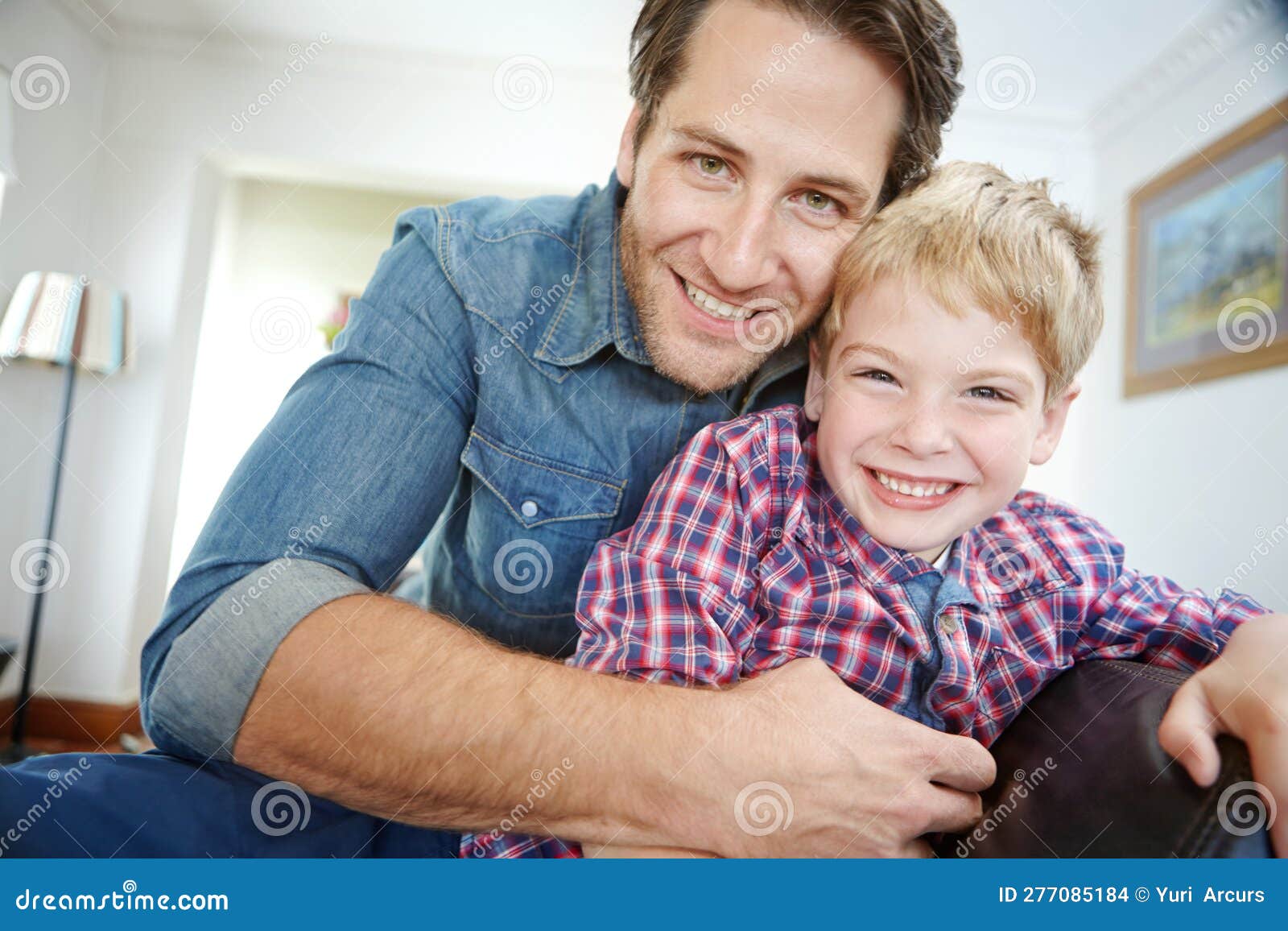 Fun Times With Dad Portrait Of A Father And Son Sitting On The Couch