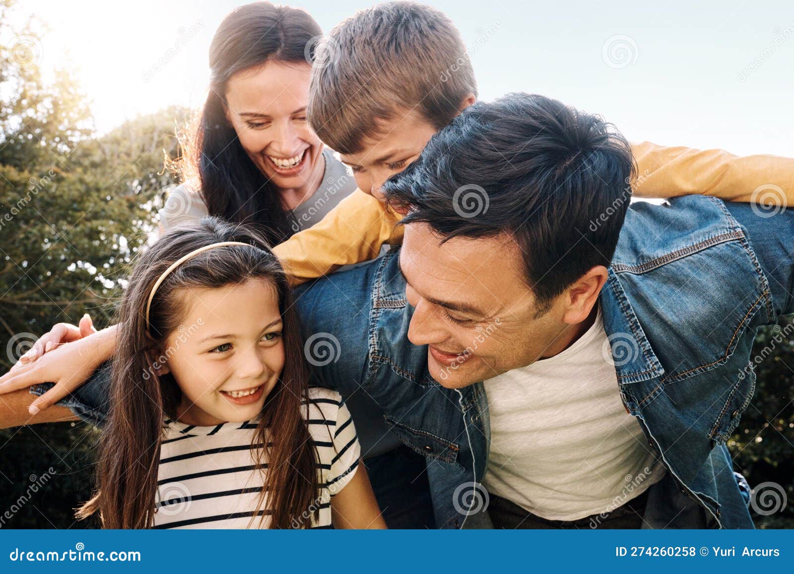 Fun Times with Family. a Happy Family of Four Having Fun Outdoors ...