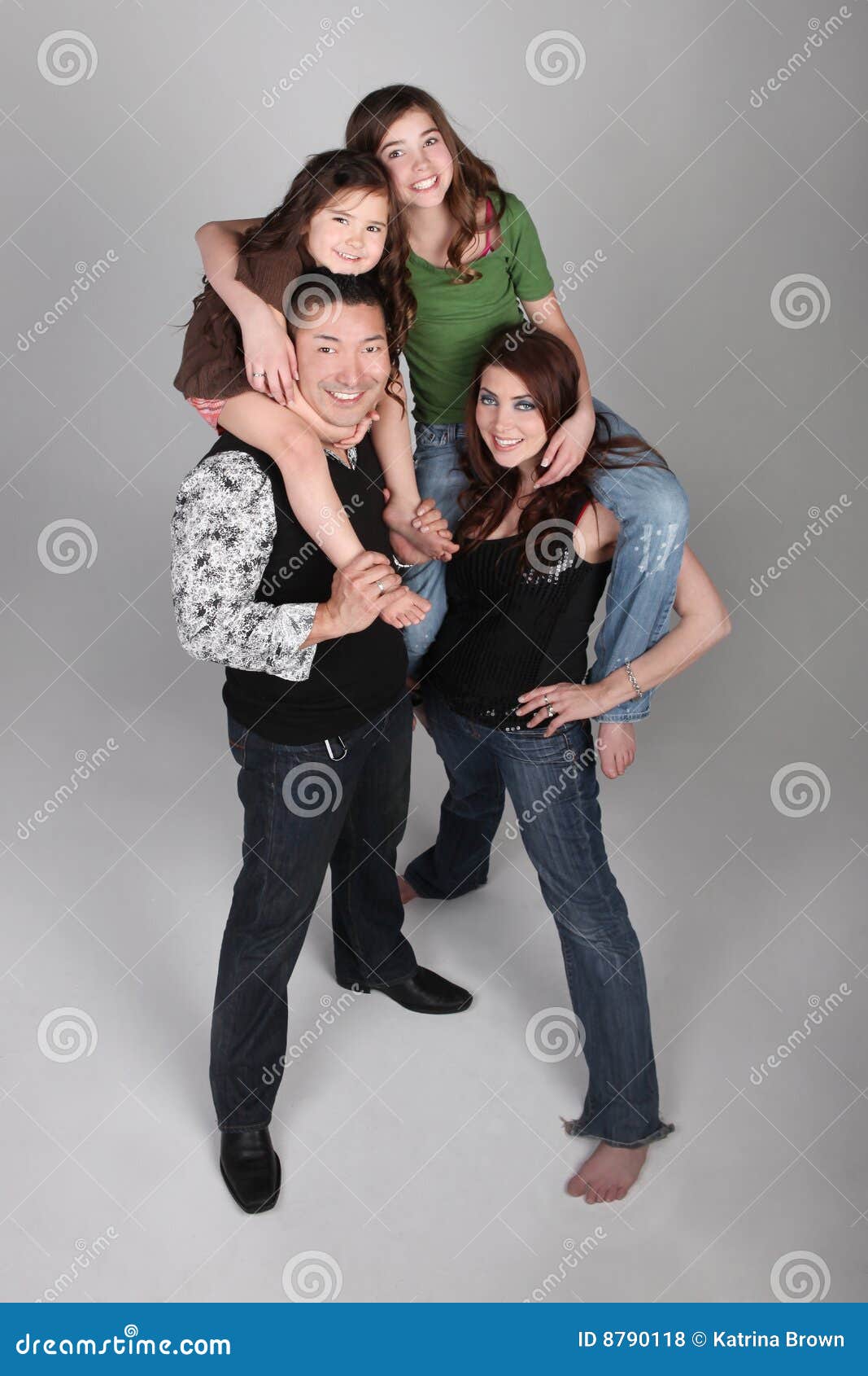 Fun and Unusual Vertical Family Portrait Stock Photo - Image of parents ...