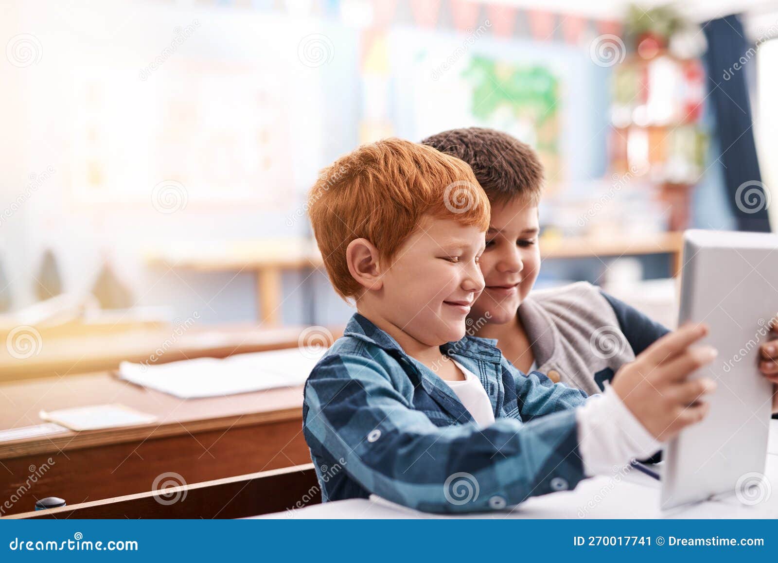 This is a Fun Way To Learn. Two Elementary School Children Browsing on ...