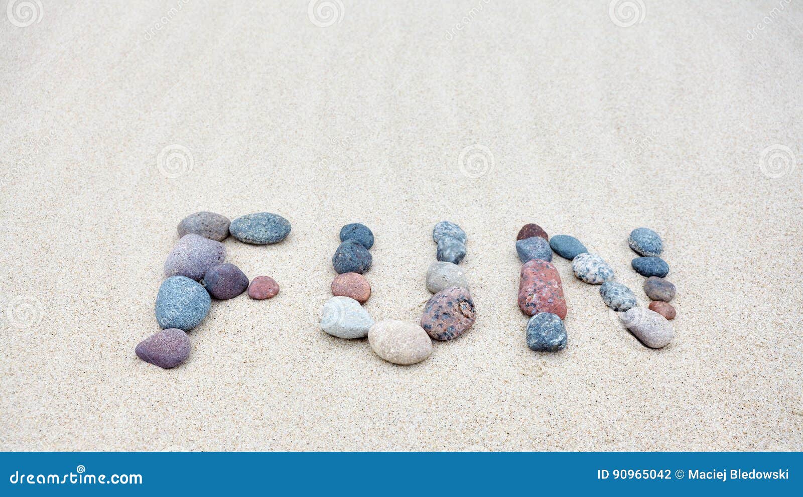 Fun Word Made of Pebbles on a Sandy Beach Stock Photo - Image of sand ...