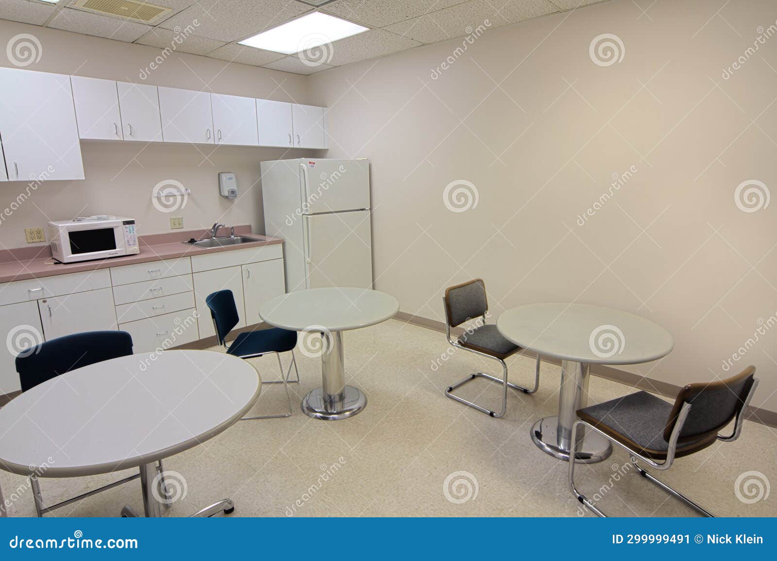 Functional Workplace Break Room with Kitchenette and Seating Area Stock ...