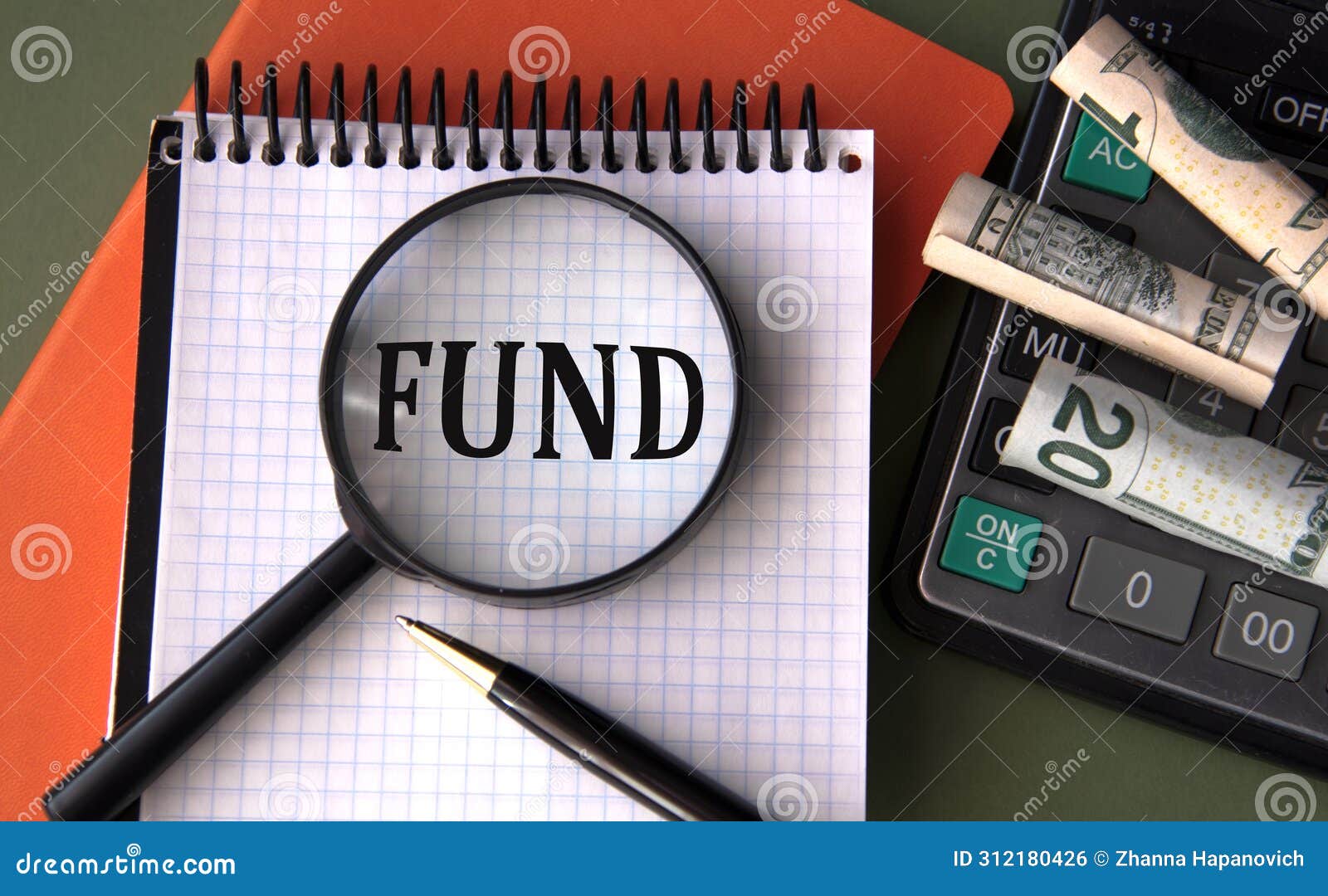 FUND - Word Under Magnifying Glass on the Background of Calculator and ...