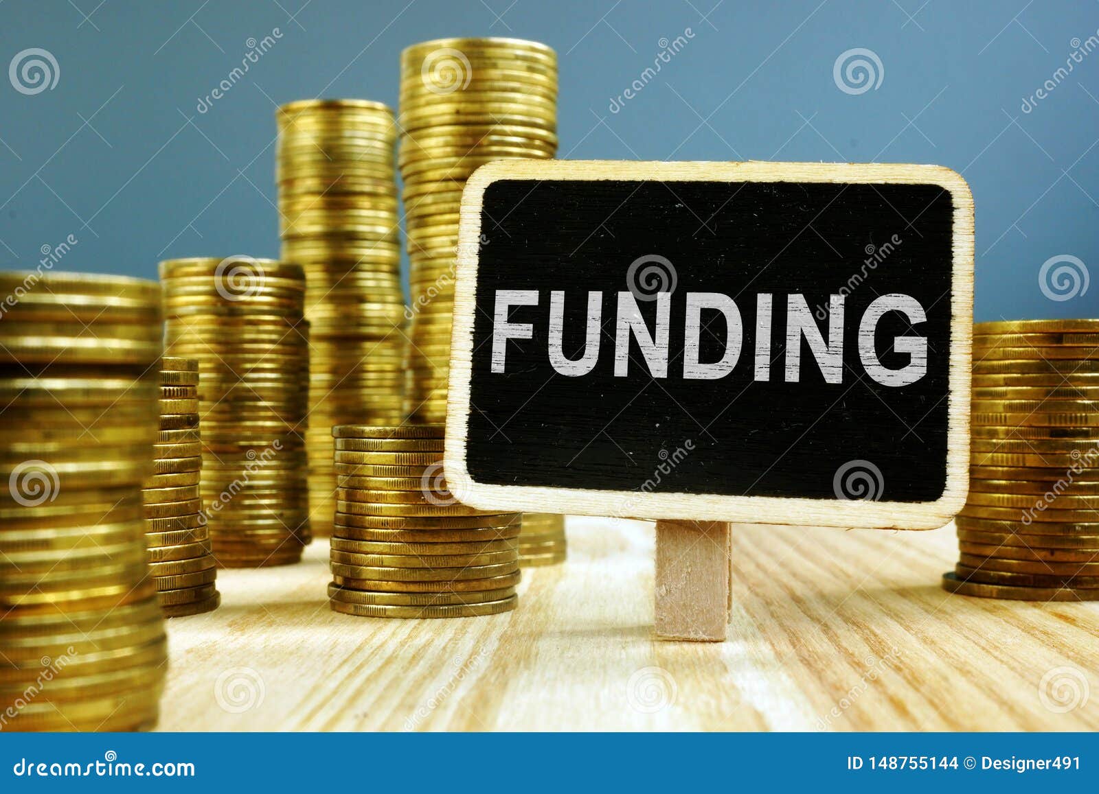 Funding Concept. Coins Stack on Wooden Surface Stock Photo - Image of ...