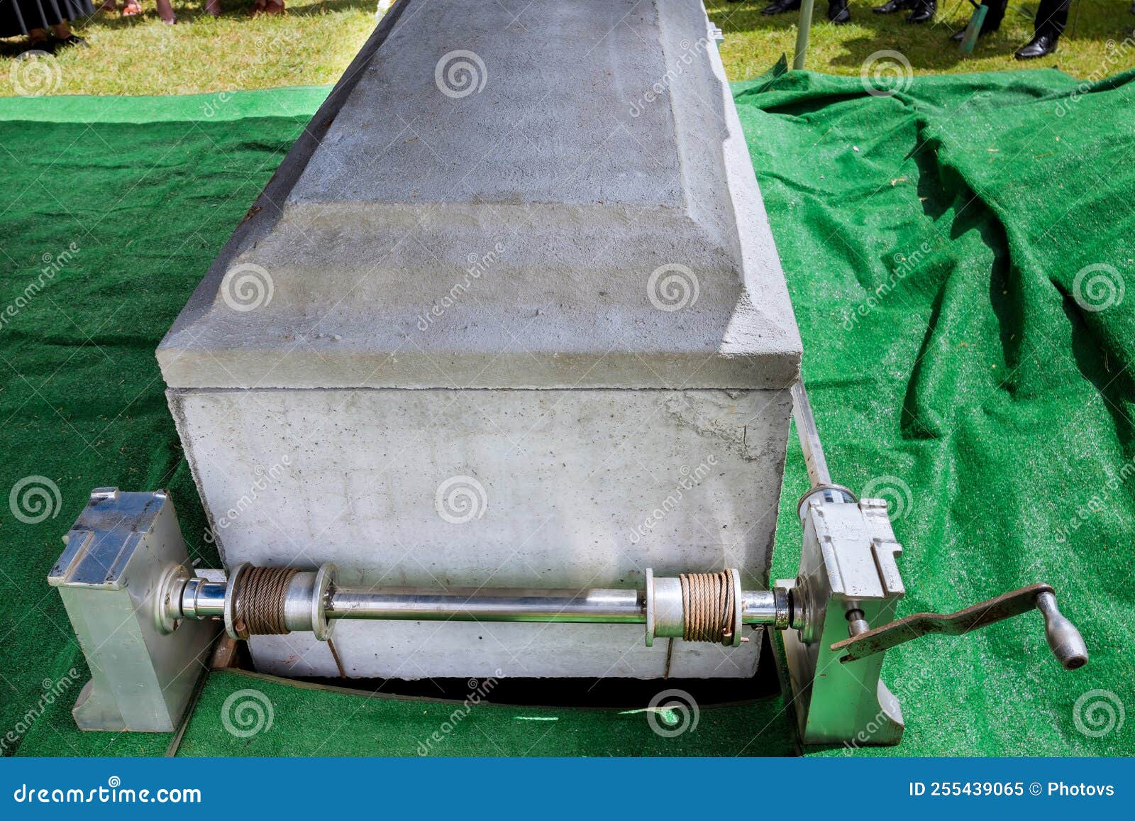 During a Funeral Service at a Cemetery, the Coffin is Placed on an ...