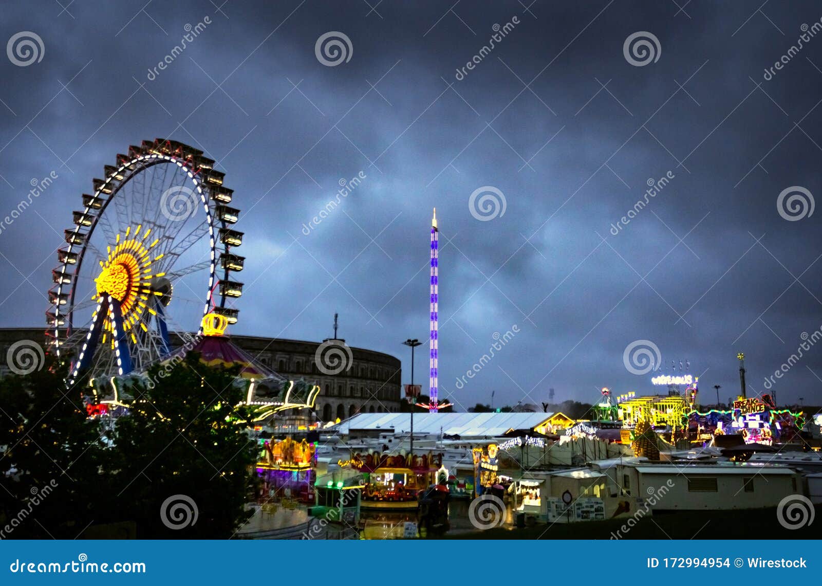 Funfair in Nuremberg Illuminated by Dramatic Light during Dusk ...