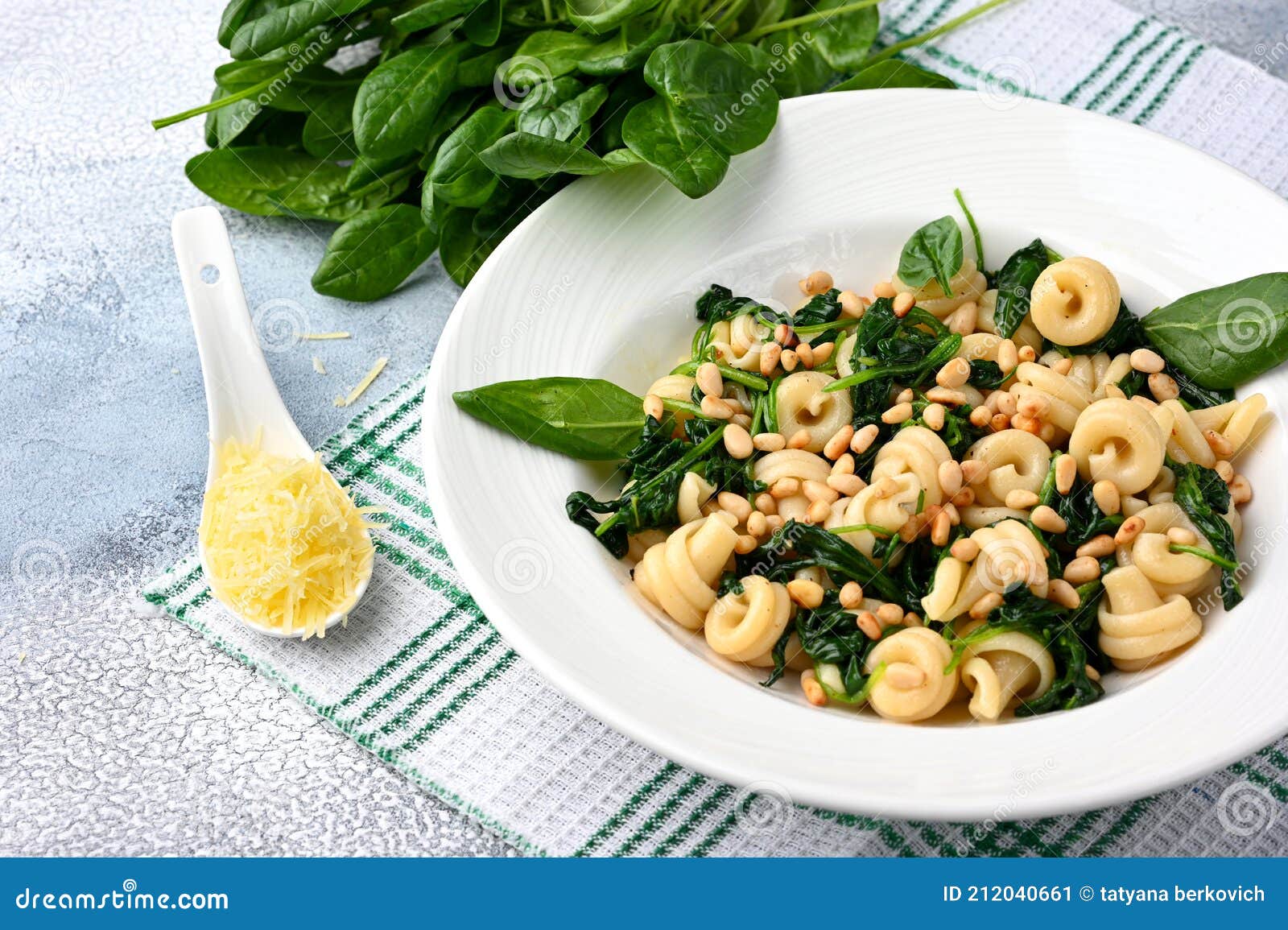 Funghetti Pasta with Spinach, Pine Nuts and Parmesan Stock Image ...