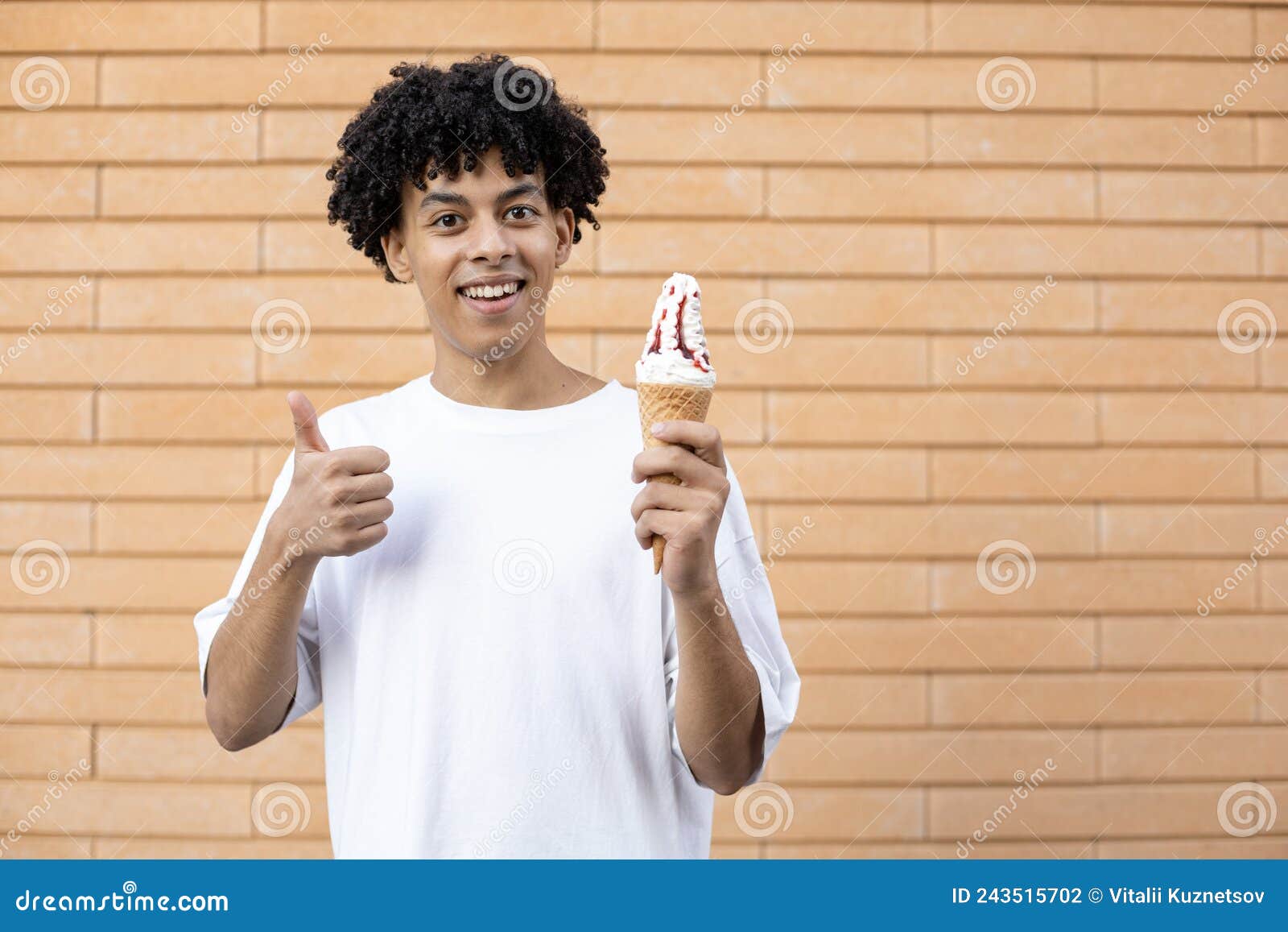 Funny African American Guy Holding An Ice Cream Cone In Hand And