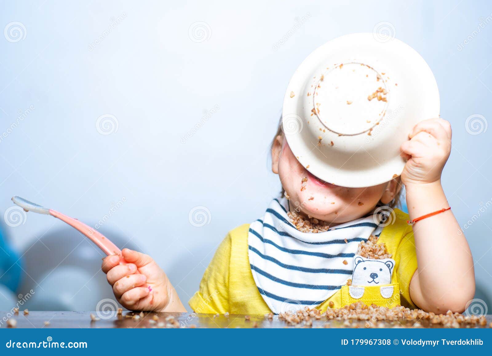 Funny Baby Eating. Little Baby Eating Dinner and Making a Mess. Stock ...