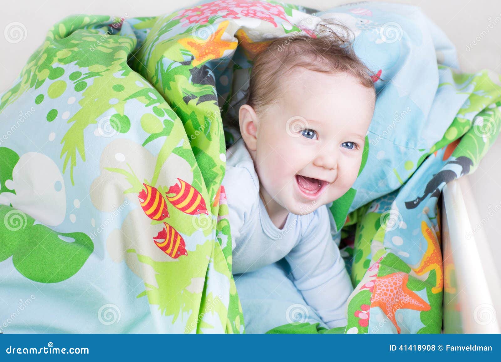 Funny Baby Playing in Bed Under Blue Blanket Stock Photo - Image of ...