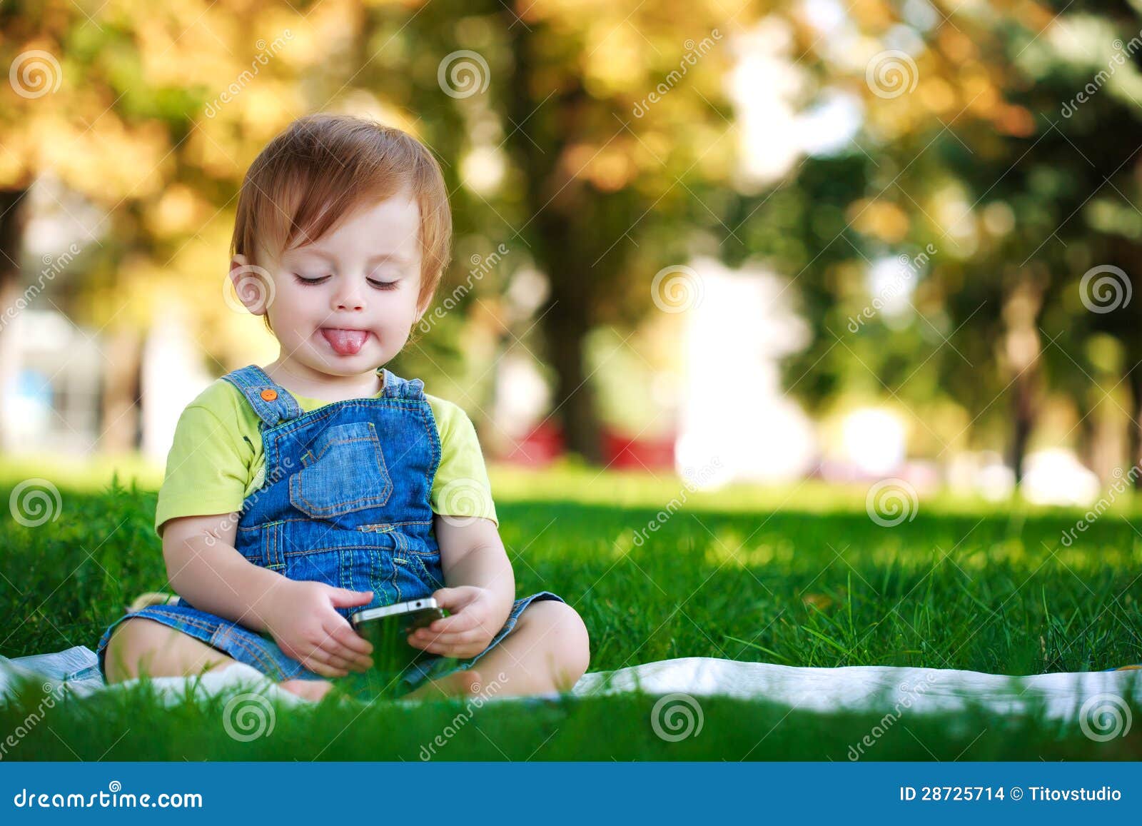 Funny Baby is Playing with Phone Stock Photo - Image of jeans, daughter ...