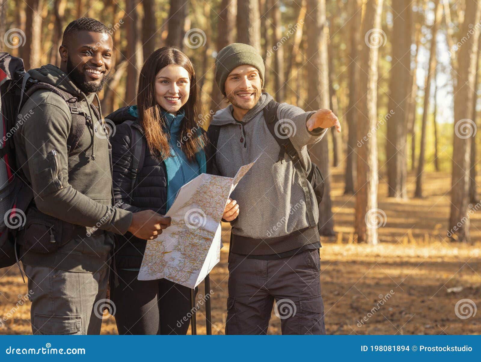 Funny Backpackers Looking for Path, Using Map Stock Photo - Image of ...