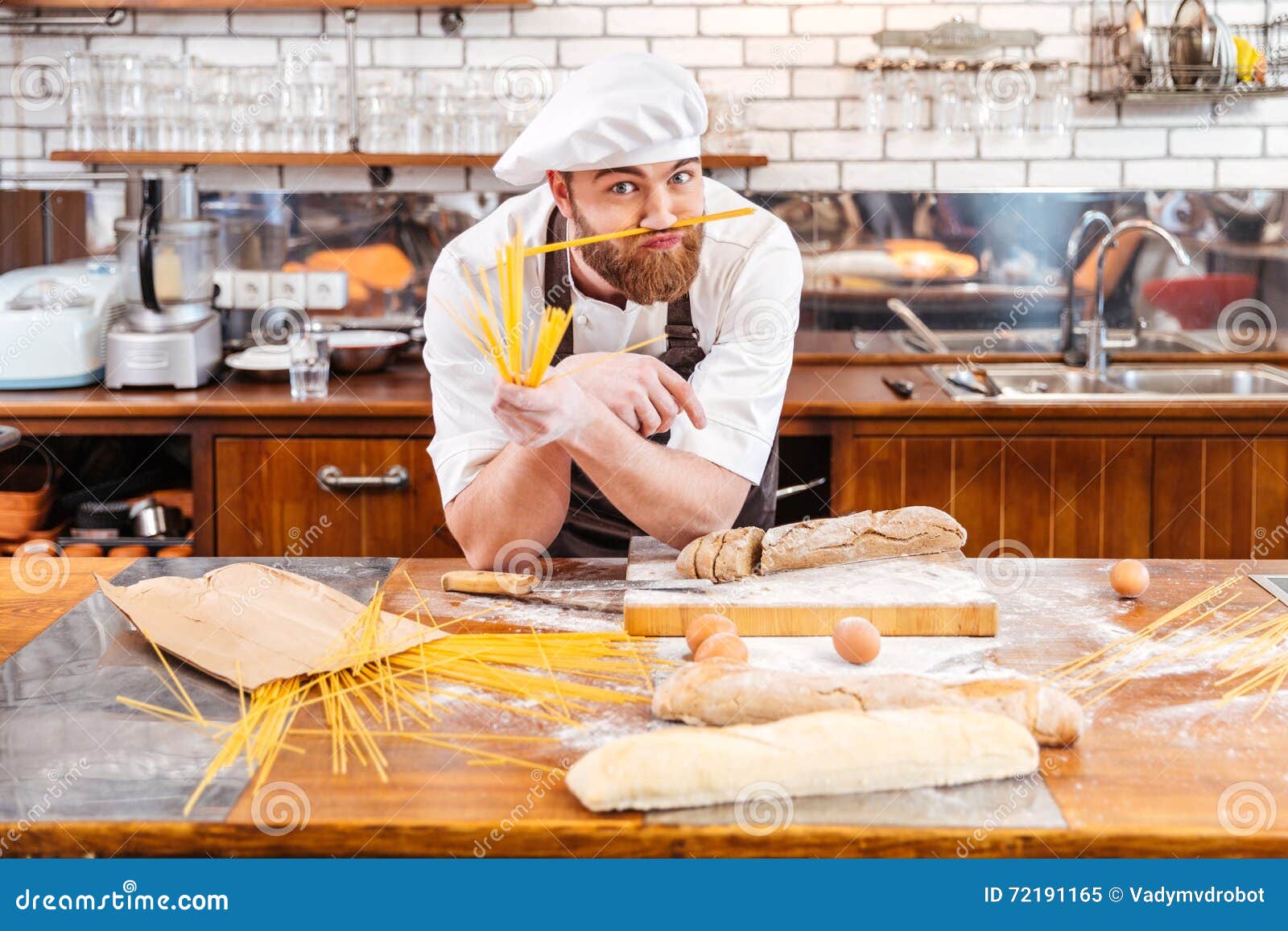 Funny Baker Making Moustache Using Macarons on the Kitchen Stock Image ...
