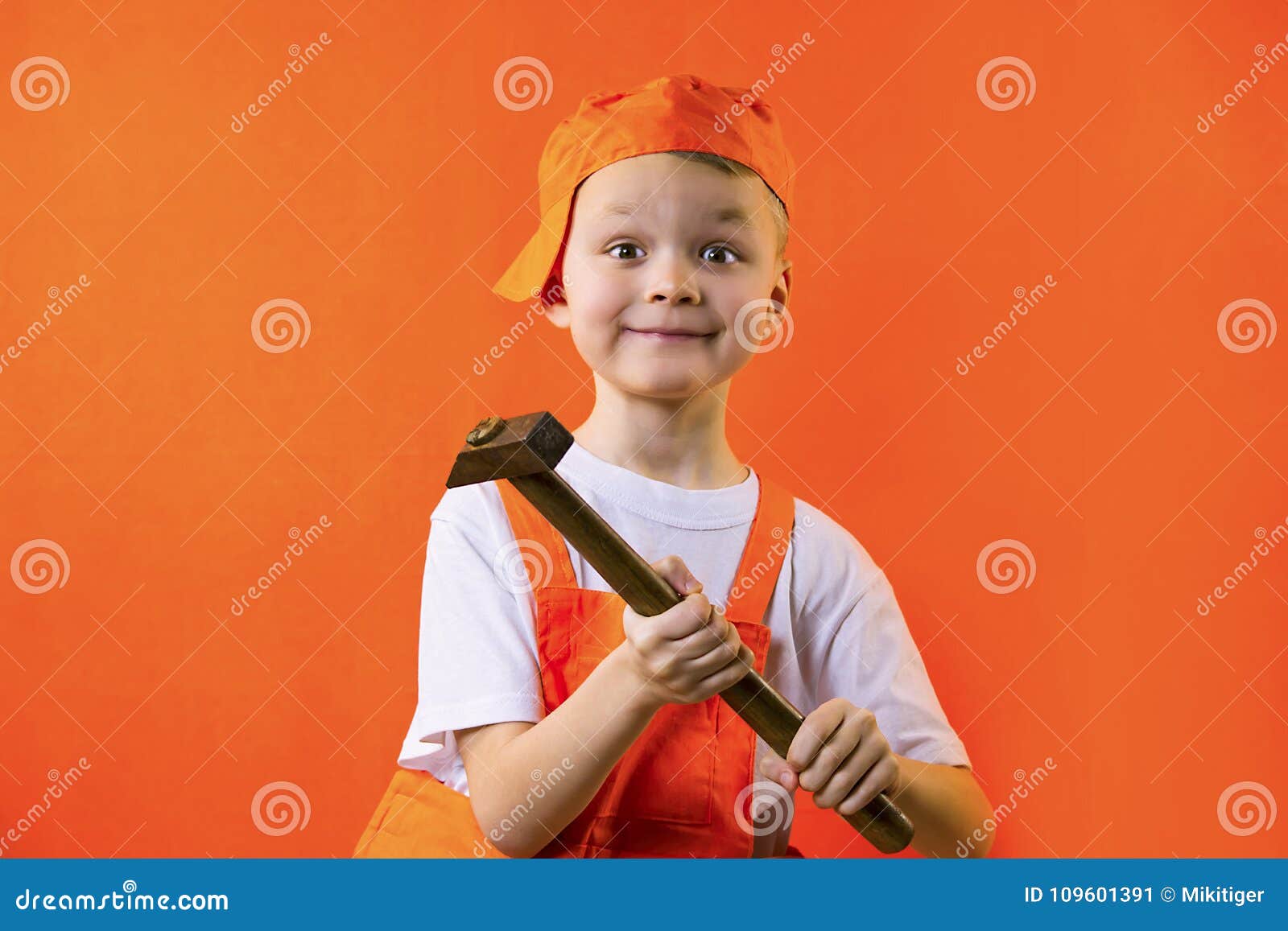 Funny Builder Boy In Uniform Holds A Hammer Stock Photography ...