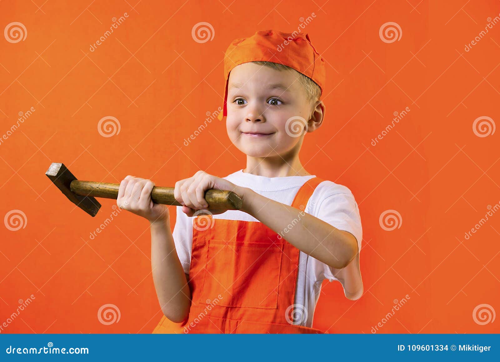 Funny Builder Boy In Uniform Holds A Hammer Royalty-Free Stock Photo ...