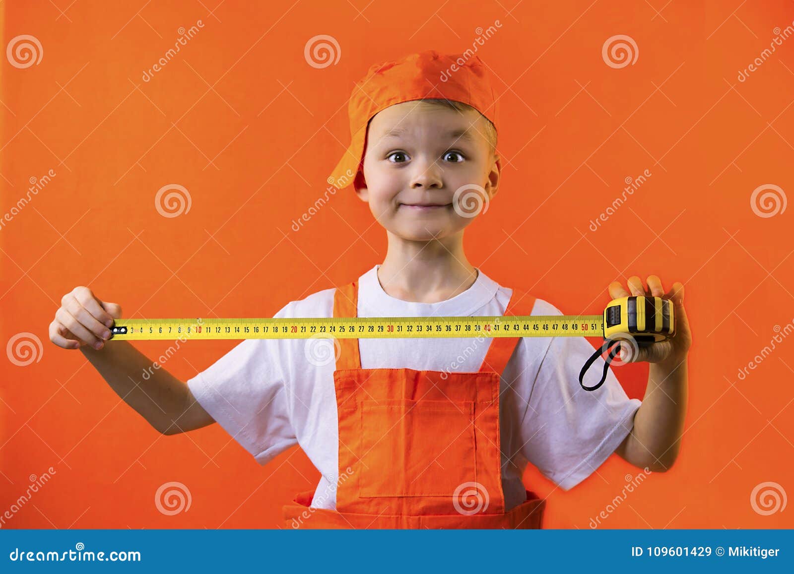 Funny Builder Boy In Uniform Holds A Screwdriver Stock Image ...