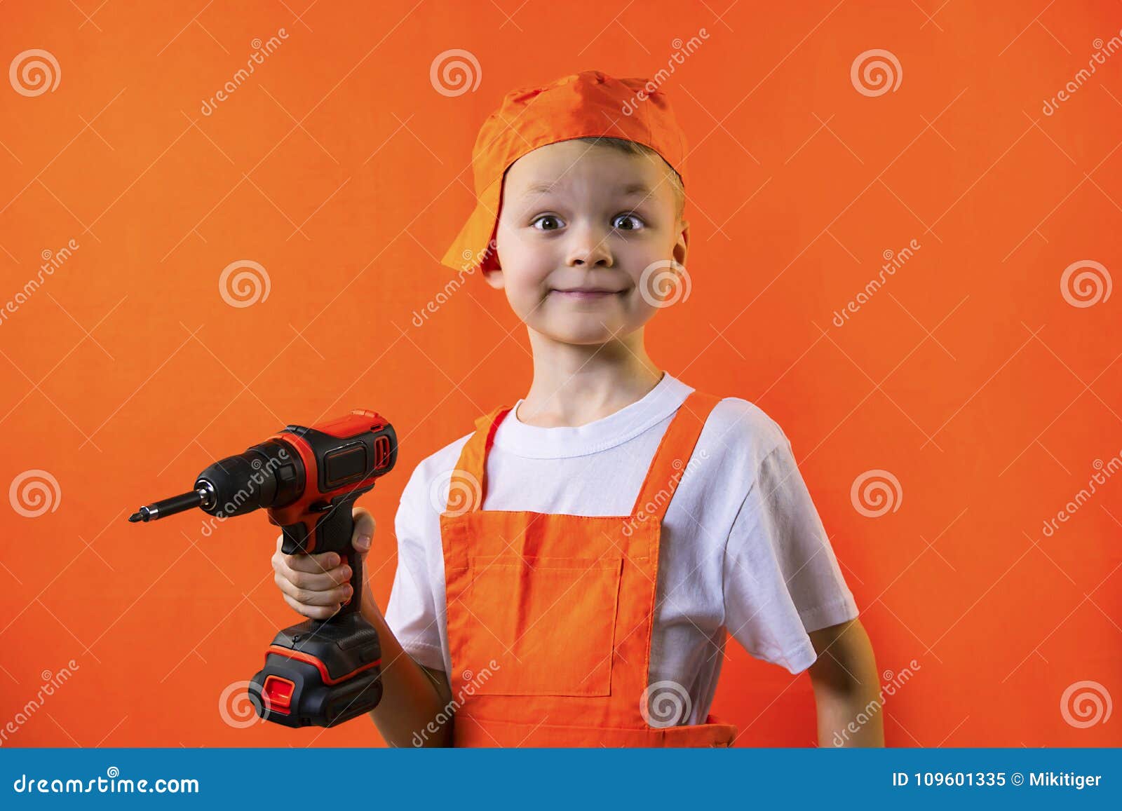 Funny Builder Boy in Uniform Holds a Screwdriver Stock Image - Image of ...