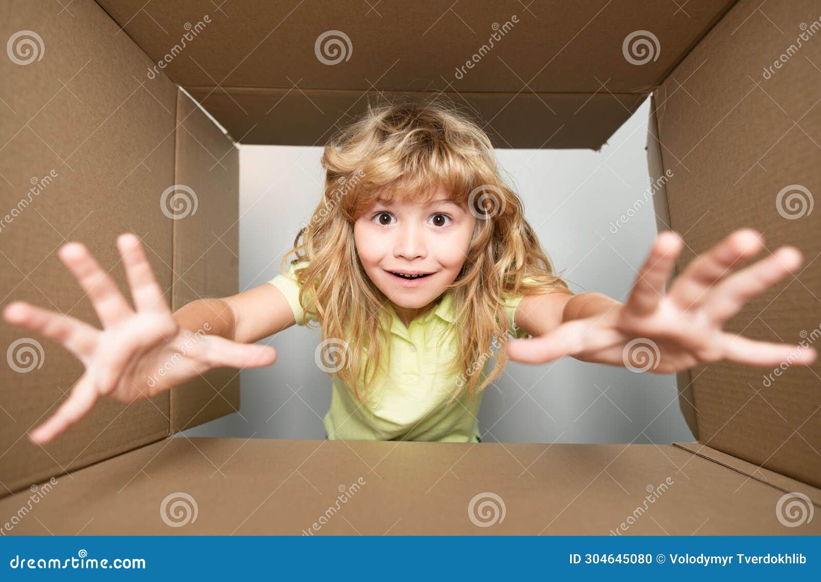 Funny Child Boy is Opening Gift and Looking Inside Cardboard Box. Child ...