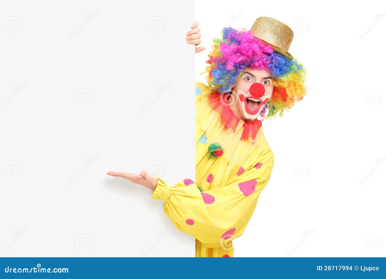 A Funny Circus Clown Posing Behind a Panel and Gesturing Stock Photo ...