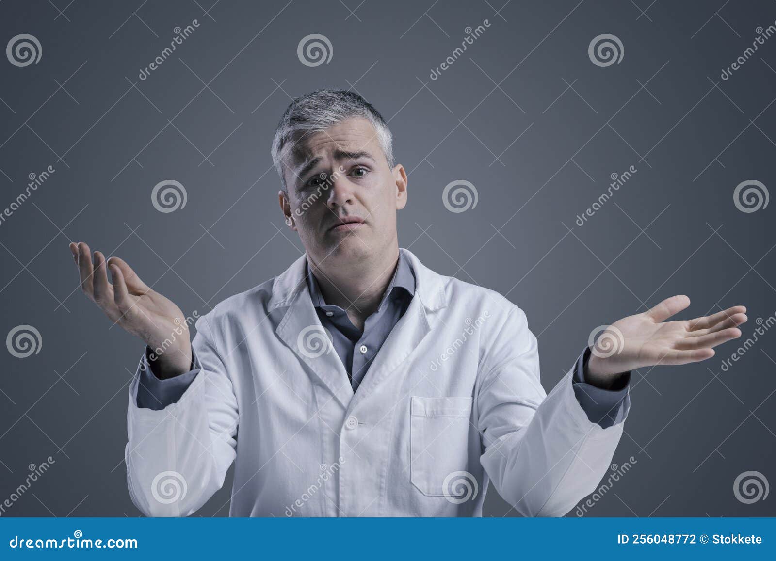 Funny Clueless Doctor Shrugging and Looking at Camera Stock Photo ...
