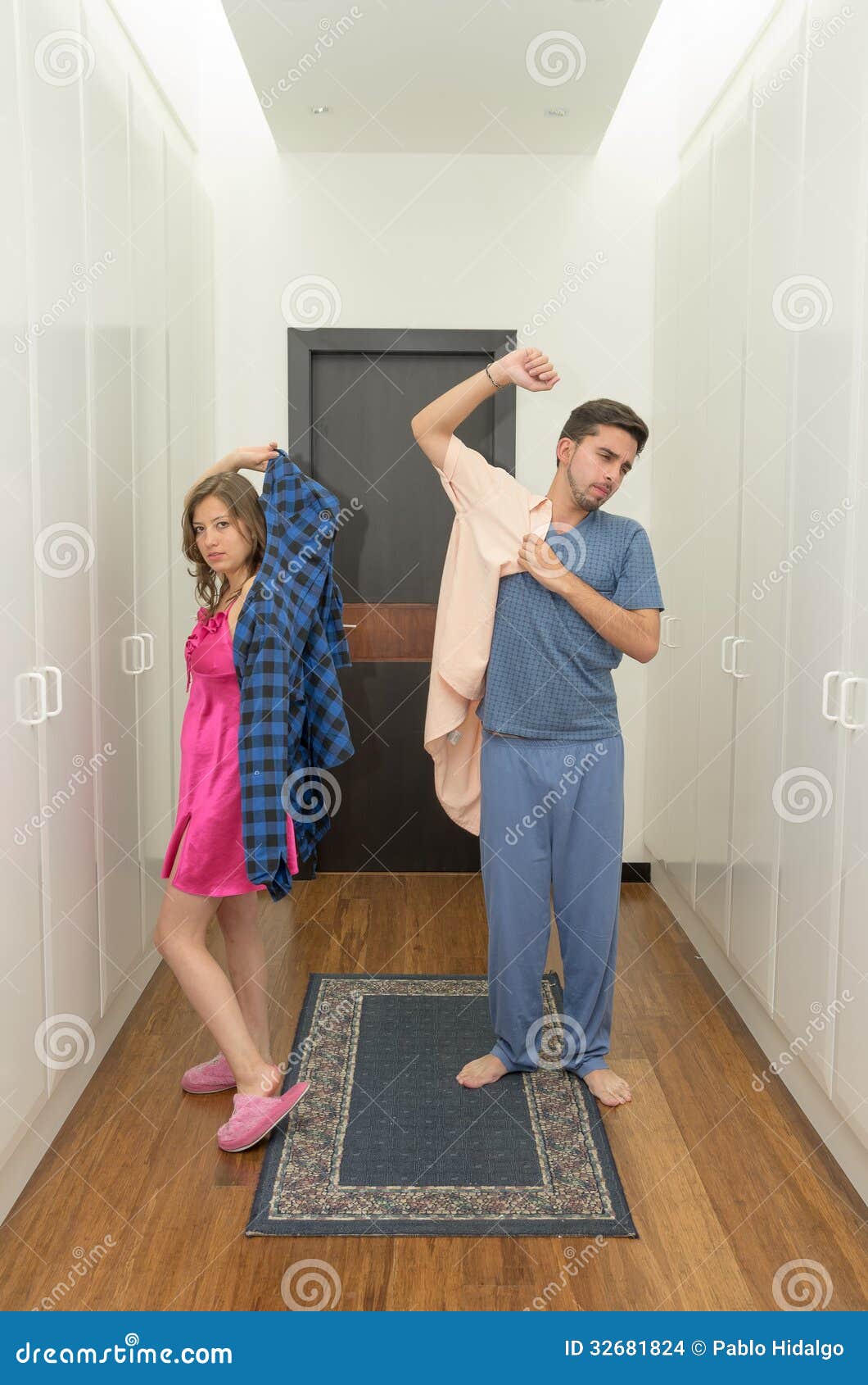 Funny Couple Getting Dressed In Pijamas Royalty-Free Stock Image ...