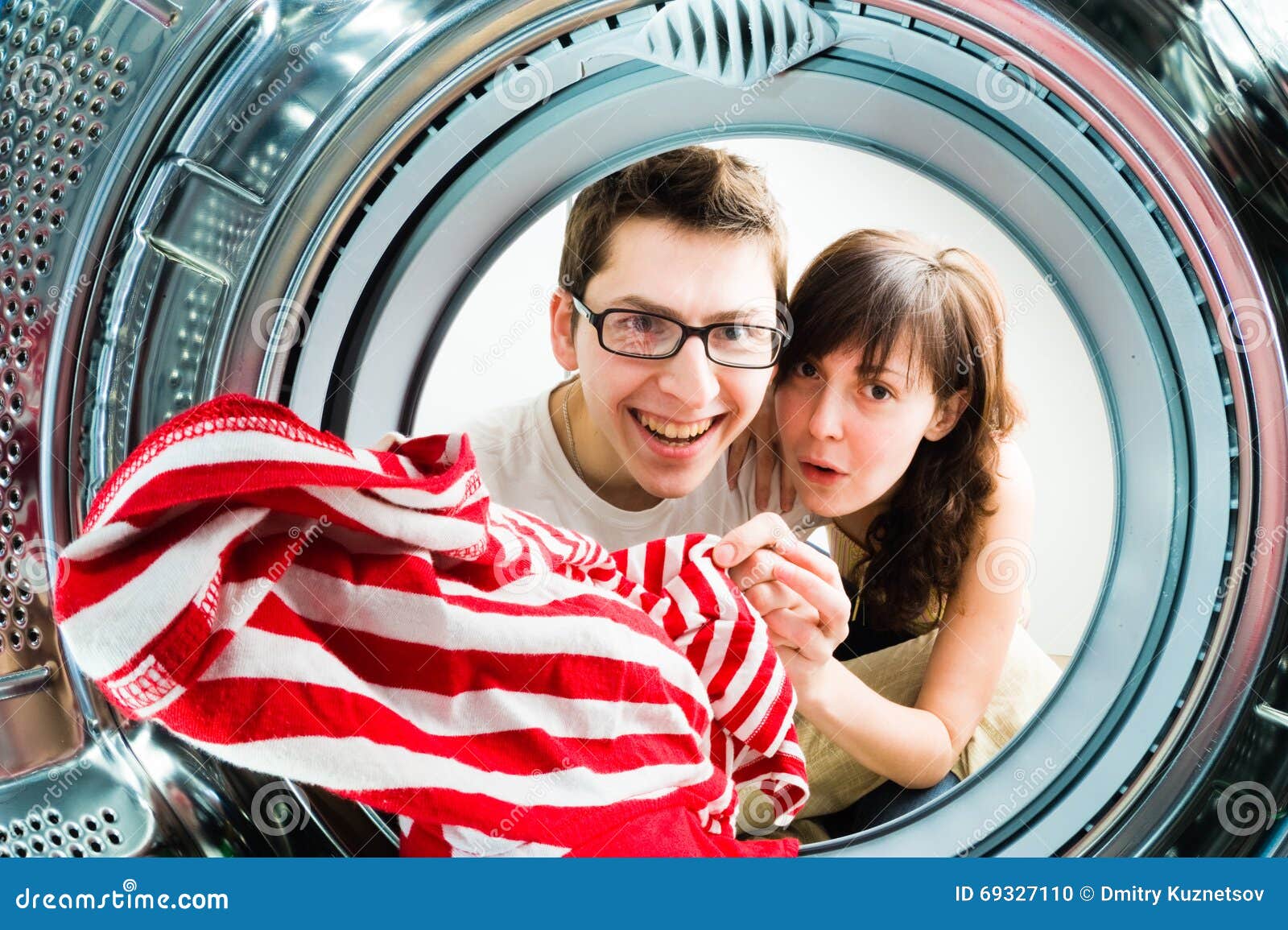 Funny Couple Loading Clothes To Washing Machine Stock Photo - Image of ...