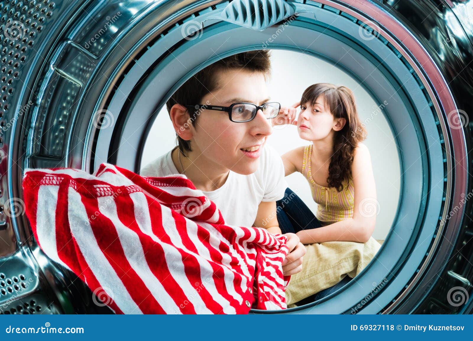 Funny Couple Loading Clothes To Washing Machine Stock Photo - Image of ...