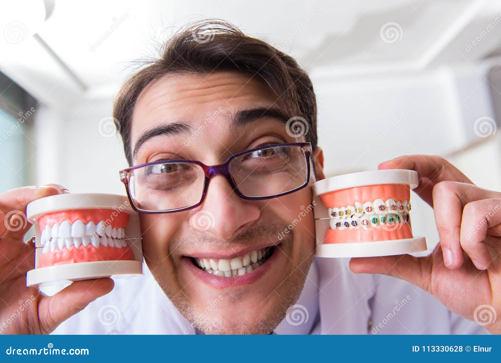 The Funny Dentist with Teeth Model in Hospital Stock Photo - Image of ...