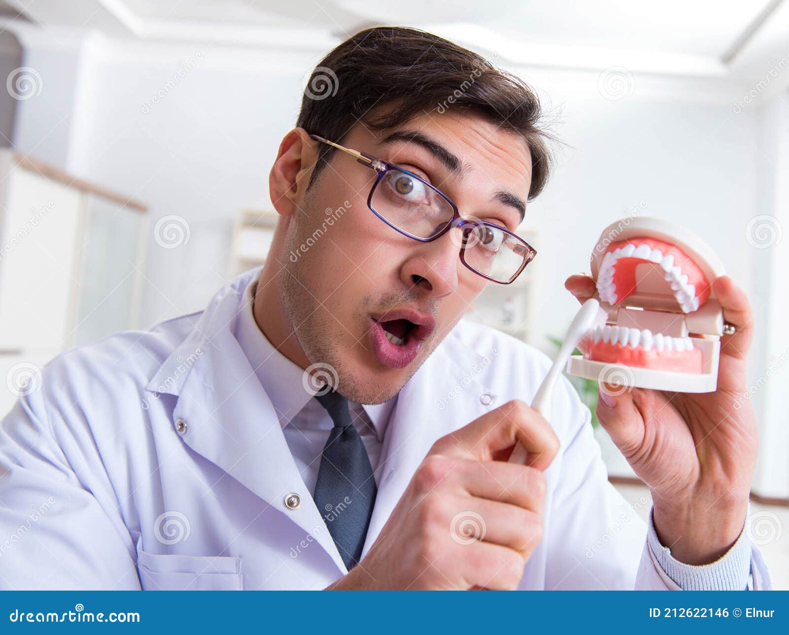 Funny Dentist with Toothbrush in Medical Concept Stock Photo - Image of ...