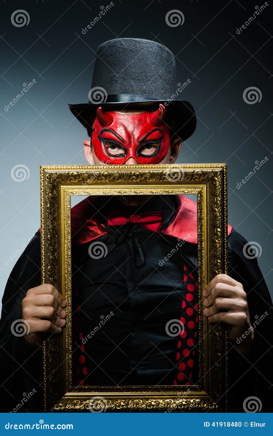 Funny devil with picture stock photo. Image of comic - 41918480