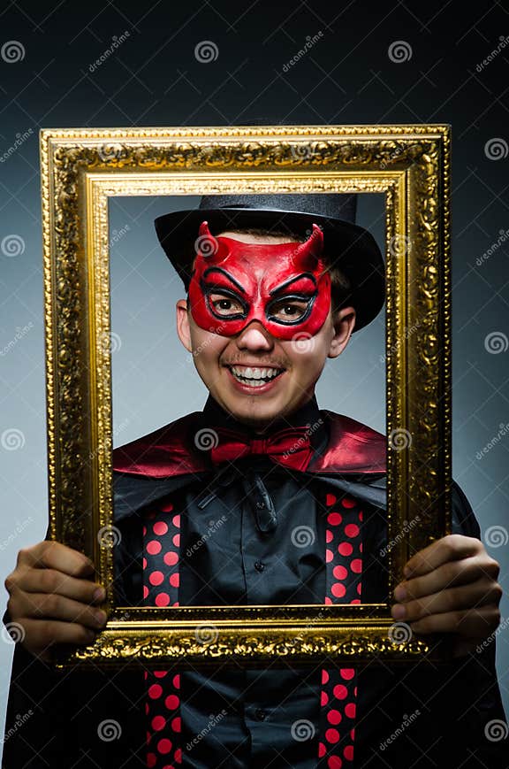 Funny devil with picture stock photo. Image of passe - 42205312
