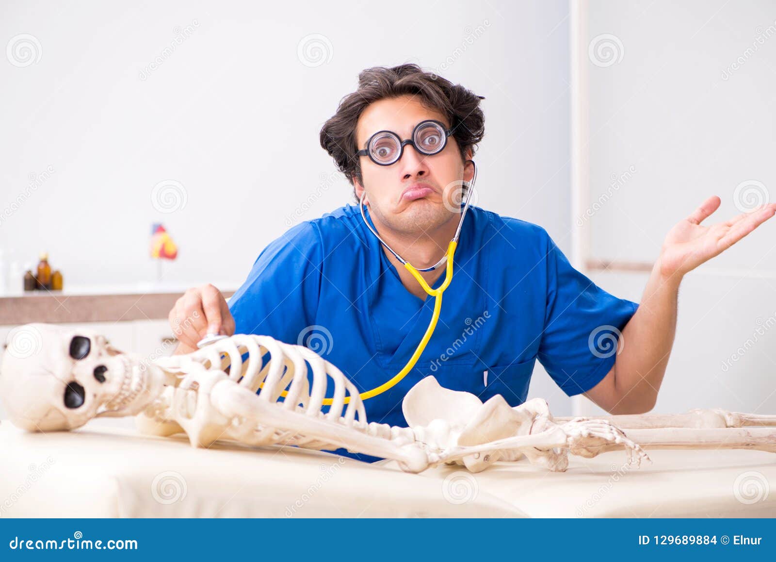The Funny Doctor with Skeleton in Hospital Stock Photo - Image of ...